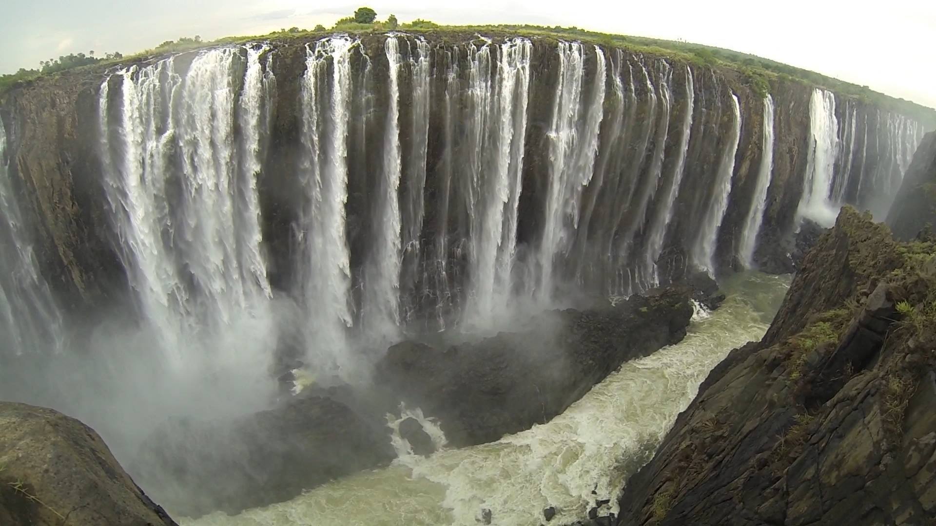 Dangling Over the Edge in the Devils Pool at Victoria Falls